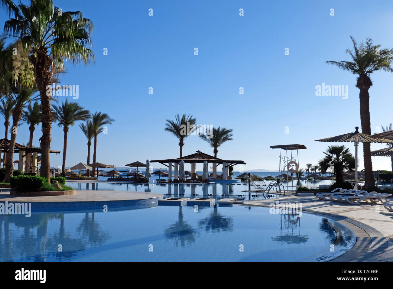 View of swimming pool at resort Stock Photo - Alamy