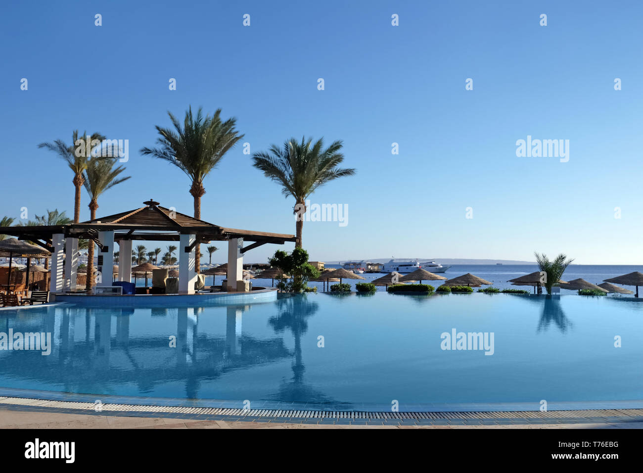 View of swimming pool at resort Stock Photo - Alamy