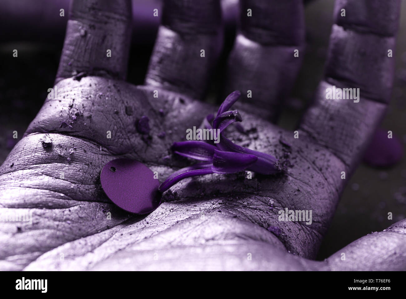 Purple human palm with sequin and flower, closeup Stock Photo - Alamy