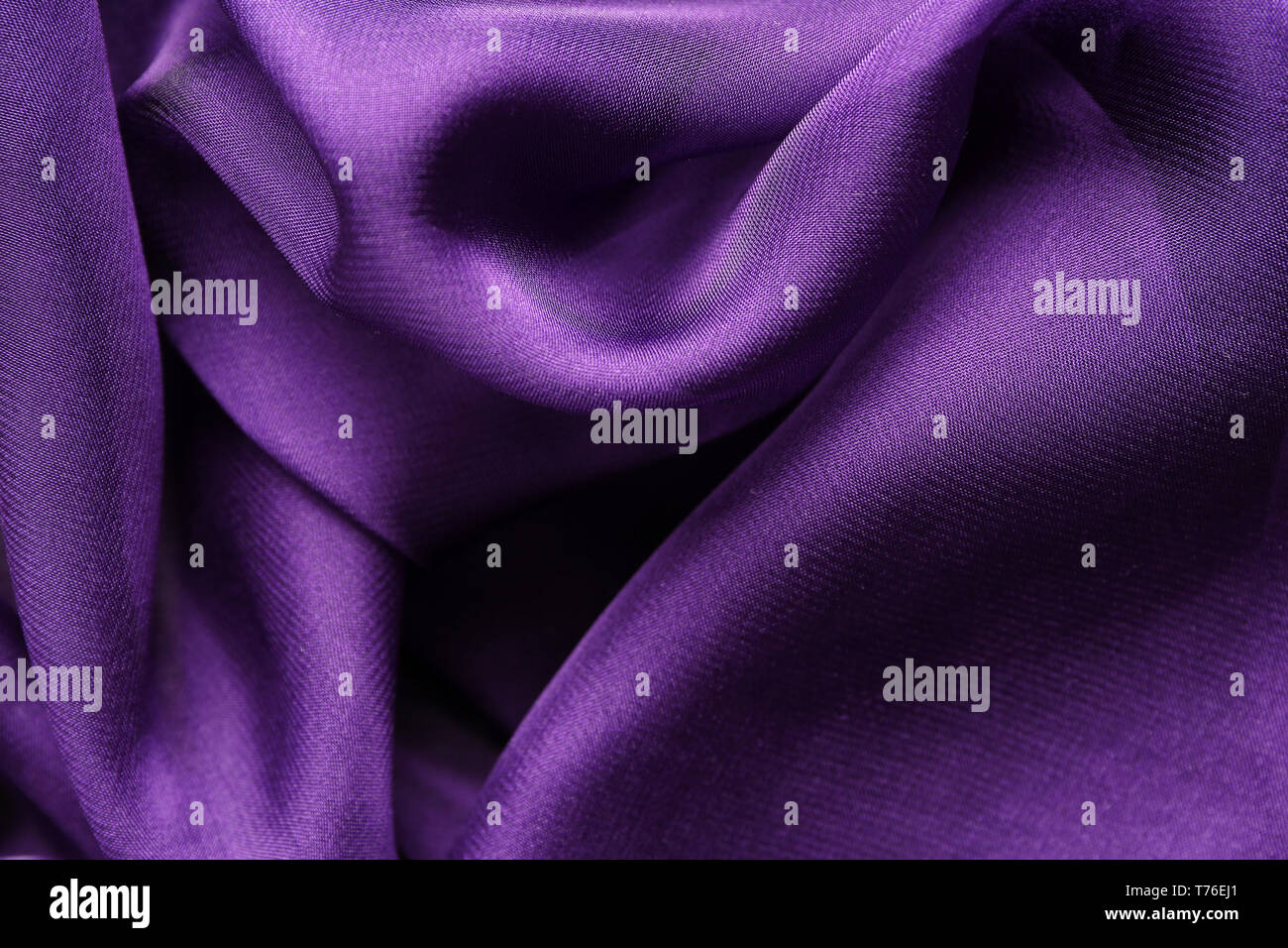 Purple fabric with folds, closeup Stock Photo - Alamy