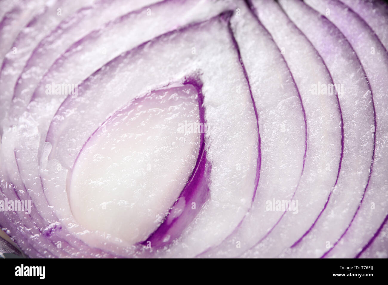 Closeup view of red onion cut Stock Photo - Alamy