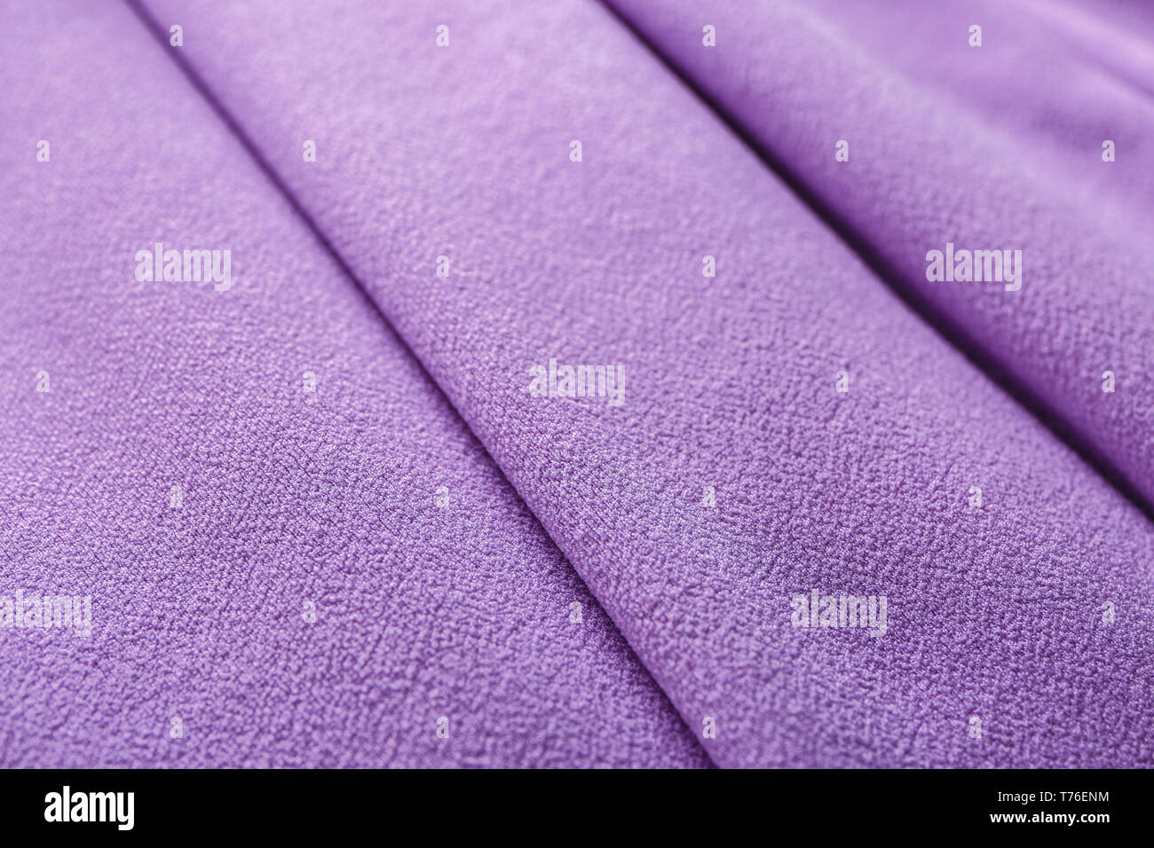 Texture of lilac fabric with folds Stock Photo - Alamy