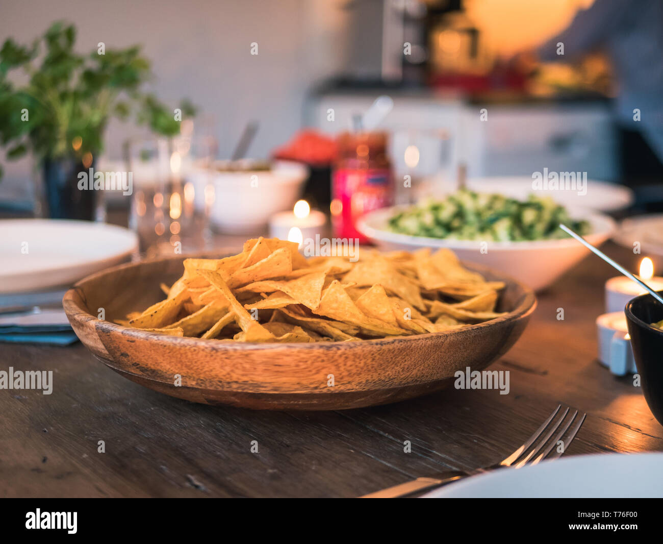 Taco or nachos dinner. Table with mexican bowls Stock Photo - Alamy