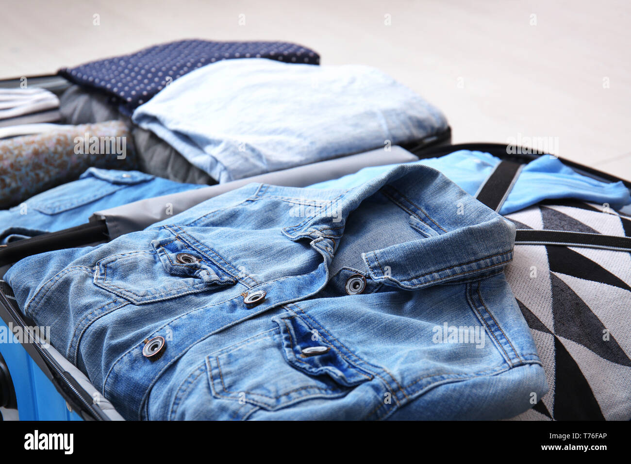 Folded clothes suitcase hi-res stock photography and images - Alamy