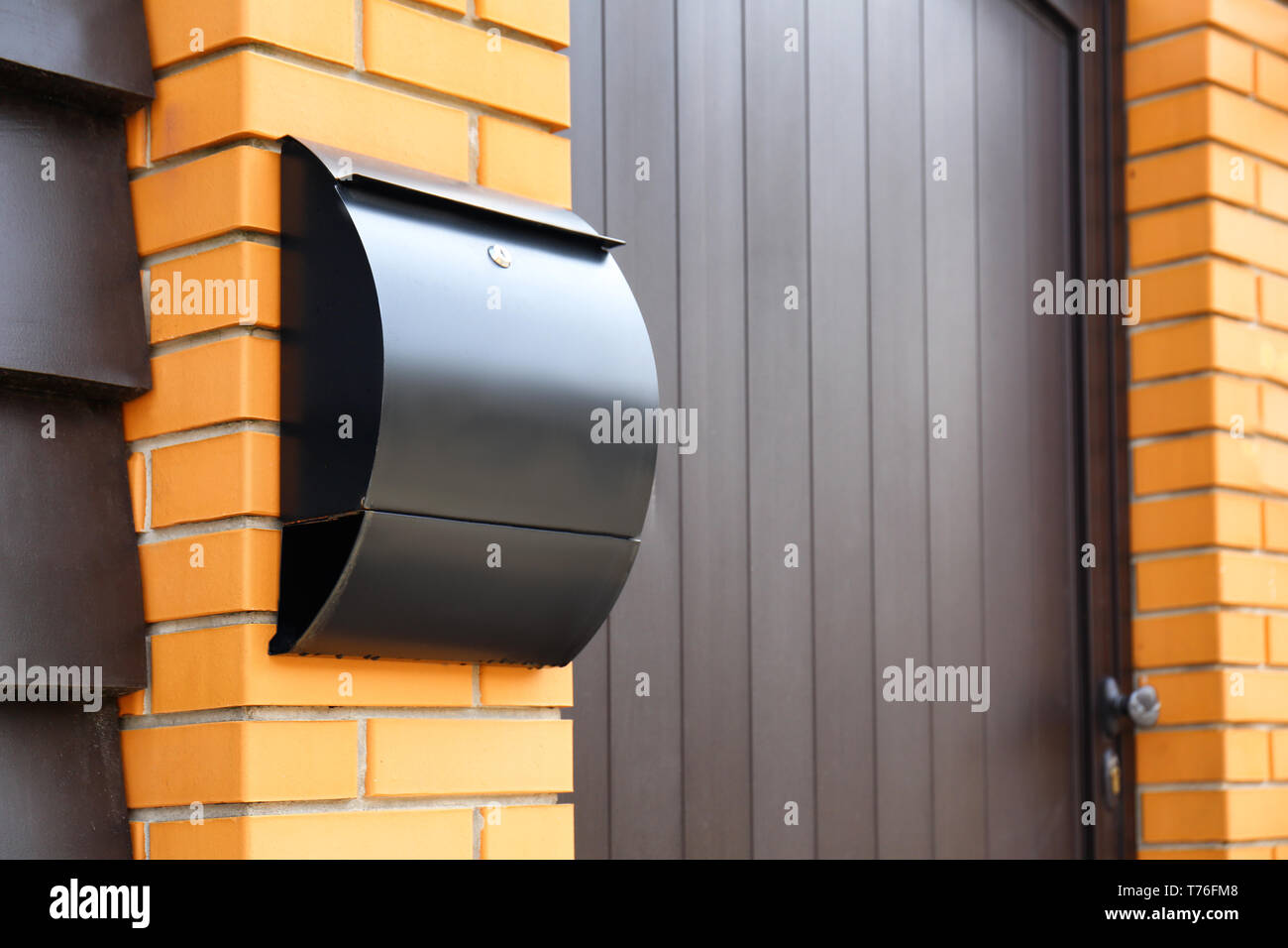 Modern mailbox on fence outdoors Stock Photo - Alamy