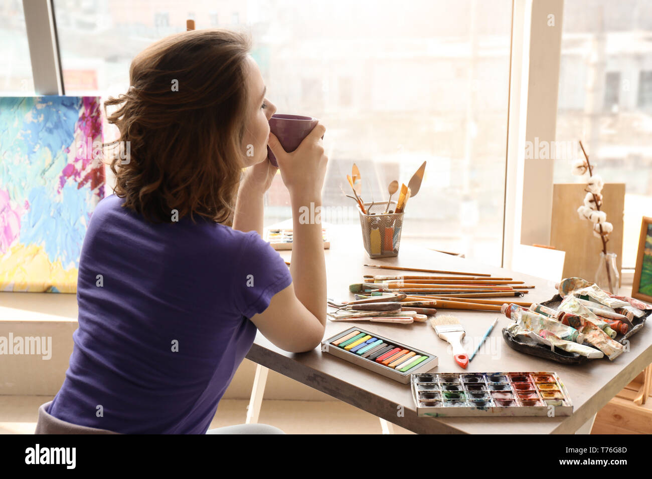 Female painter drinking coffee hi-res stock photography and images - Alamy
