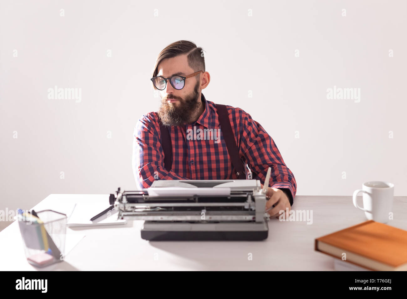 people, writer and hipster concept - young stylish writer working on ...