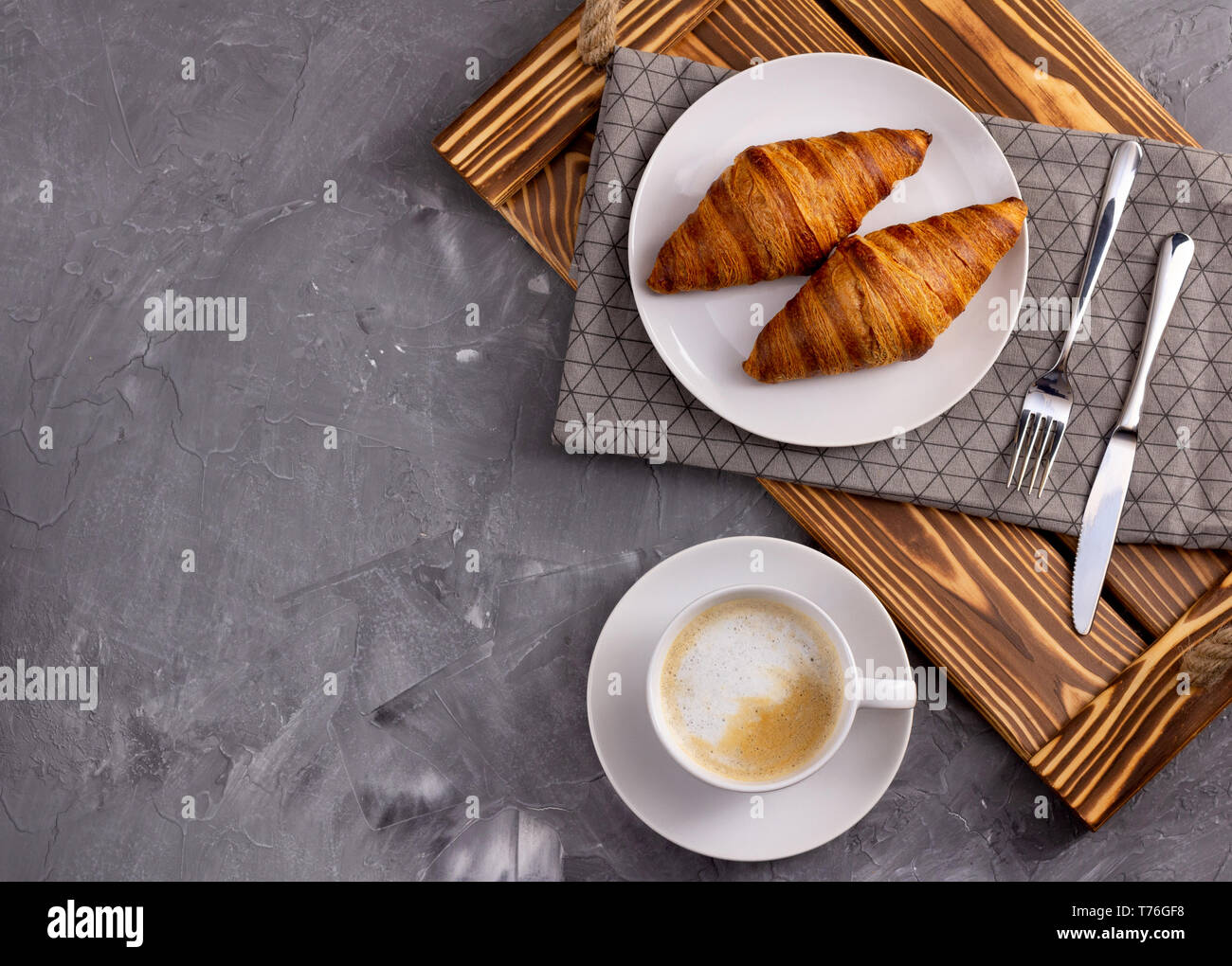Continental traditional breakfast. Flatlay of croissant, a cup of ...