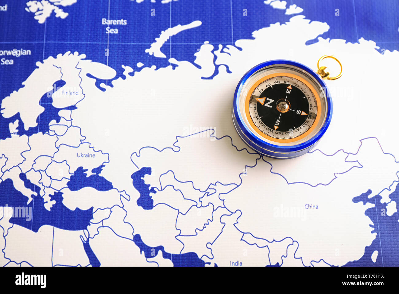 Compass on world map Stock Photo - Alamy