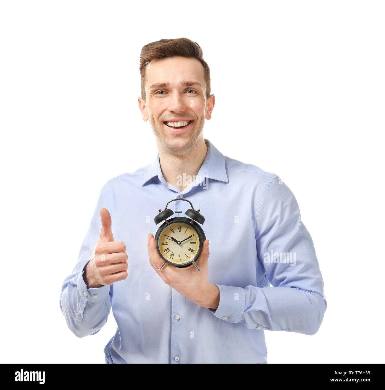 Successful businessman with alarm clock on white background. Time ...