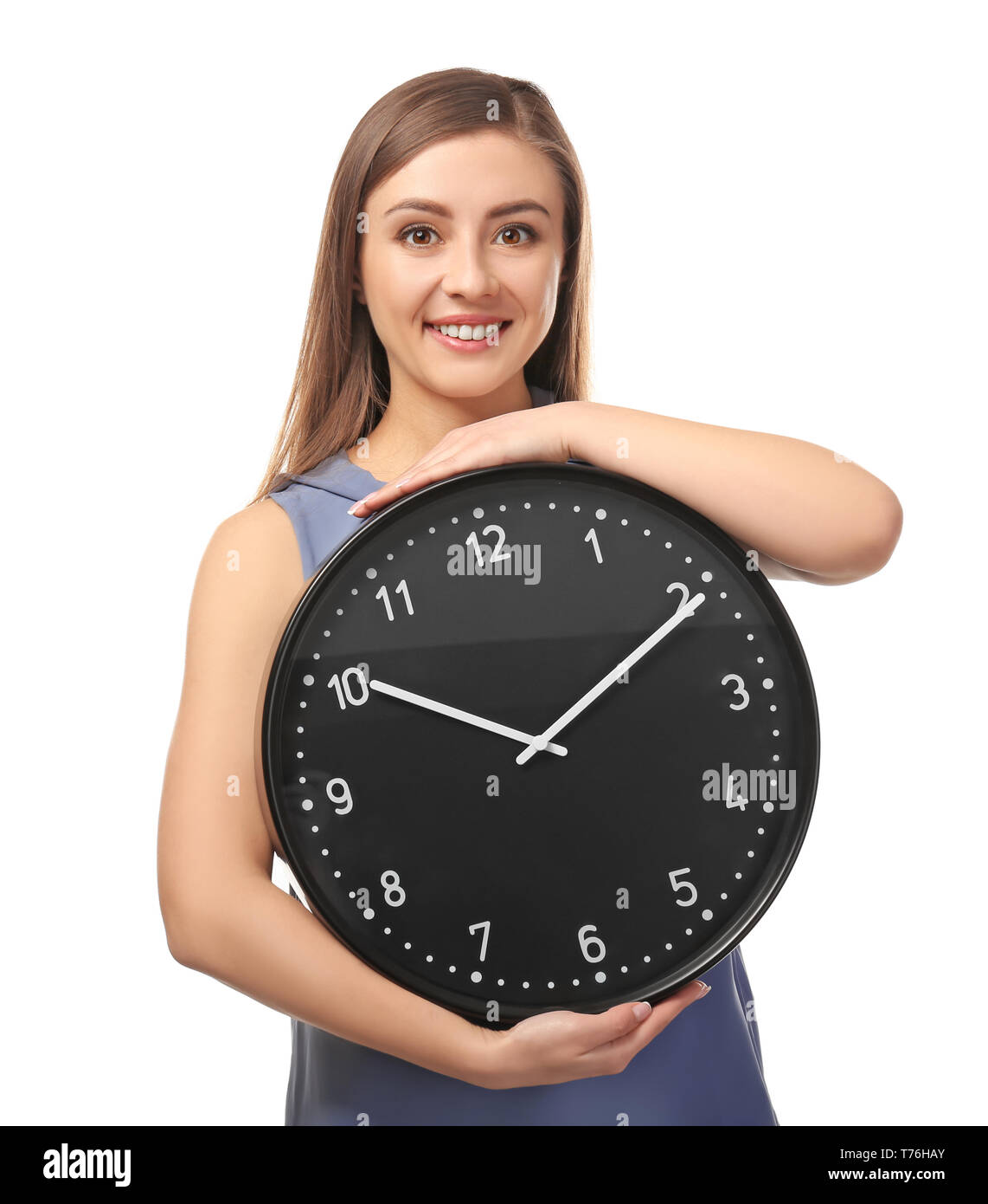 Young woman with clock on white background. Time management concept ...