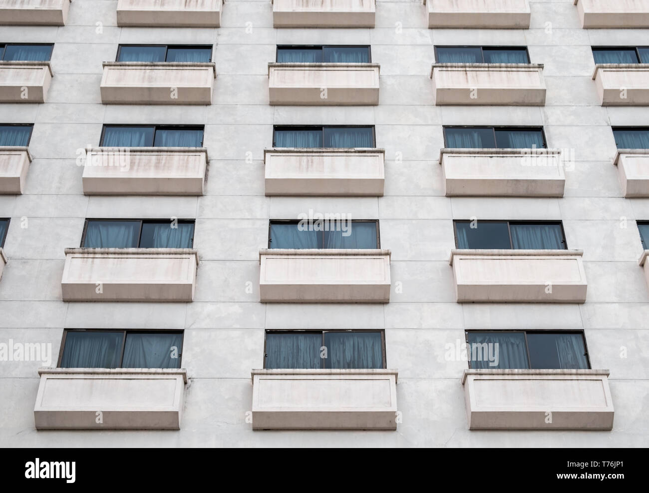 Windows balcony with curtain on hotel structure Stock Photo - Alamy