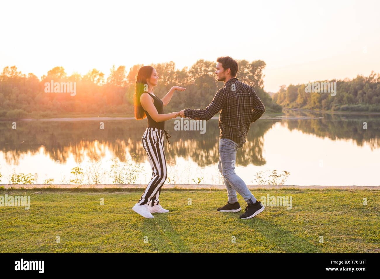 Romantic, social dance and people concept - young couple dancing ...