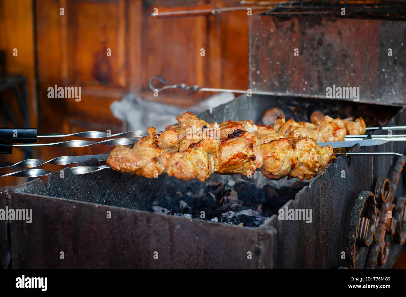 Skewers with the meat fried on charcoal. Traditional shashlik. Grilled ...