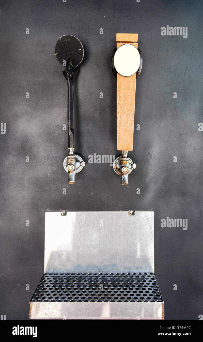 Draught beer tabs on black bar Stock Photo - Alamy