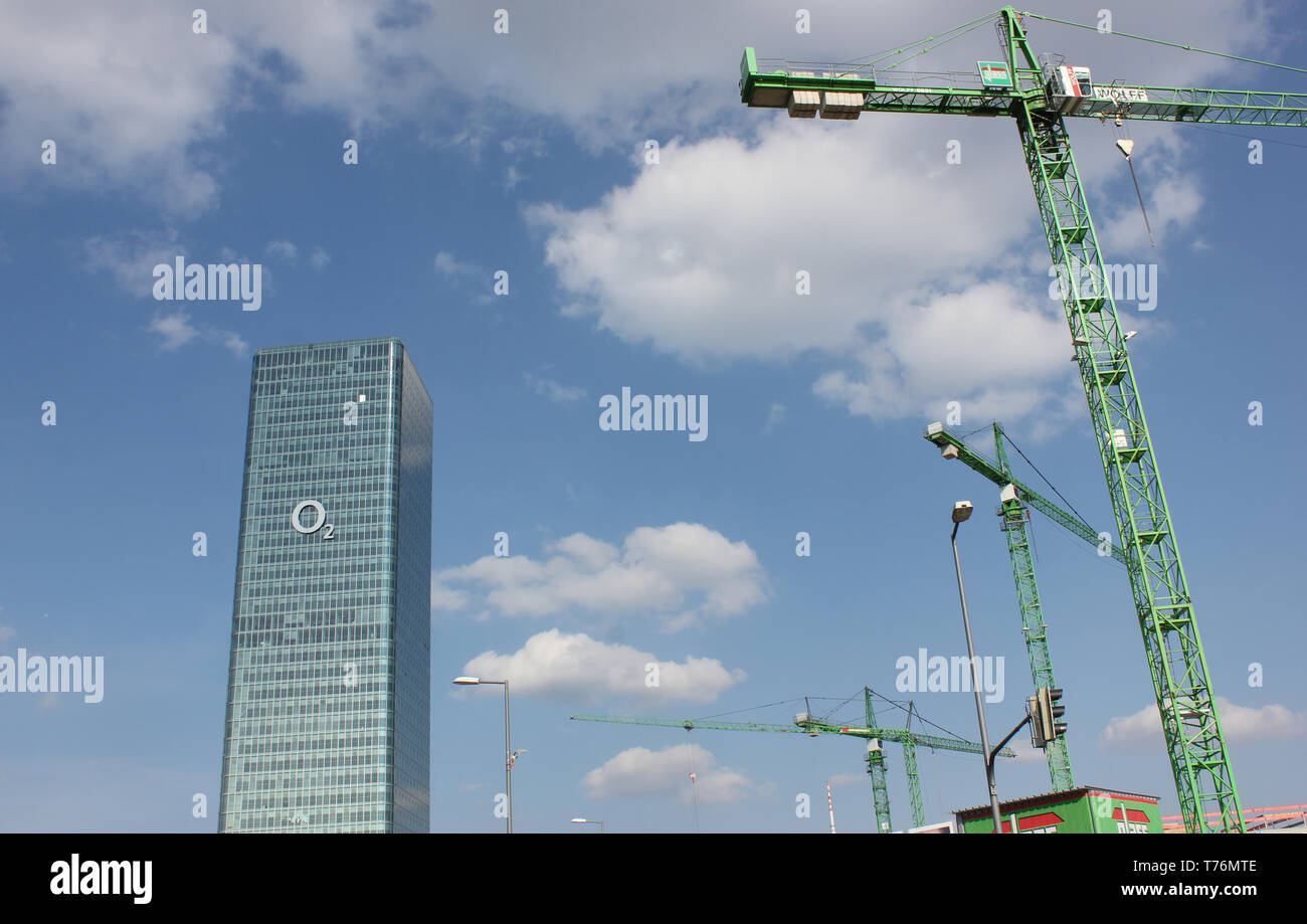 O2 Tower, german branch office in Munich, surroundet by cranes of a ...