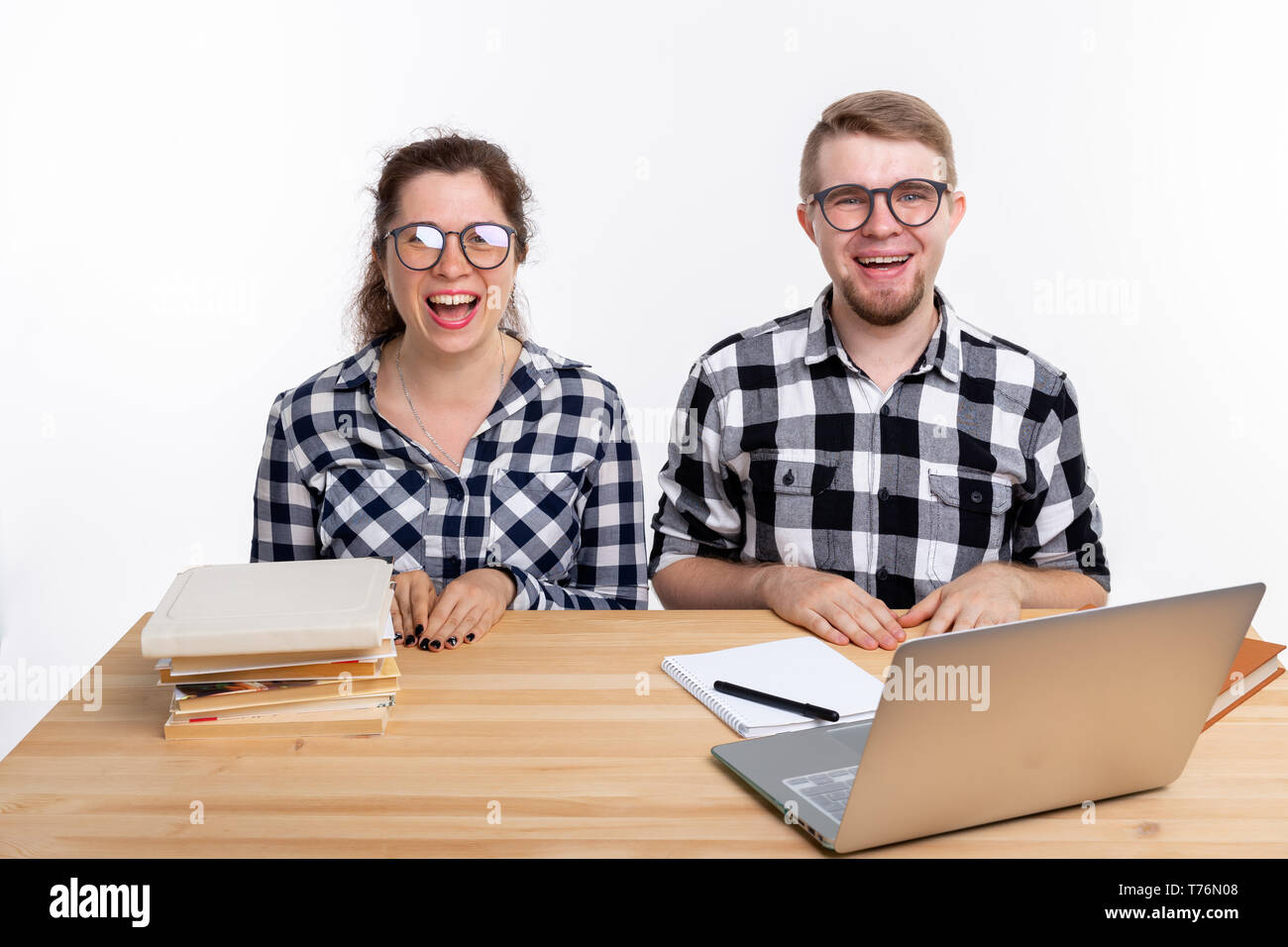 Education, students, people concept - funny couple of teens in glasses ...