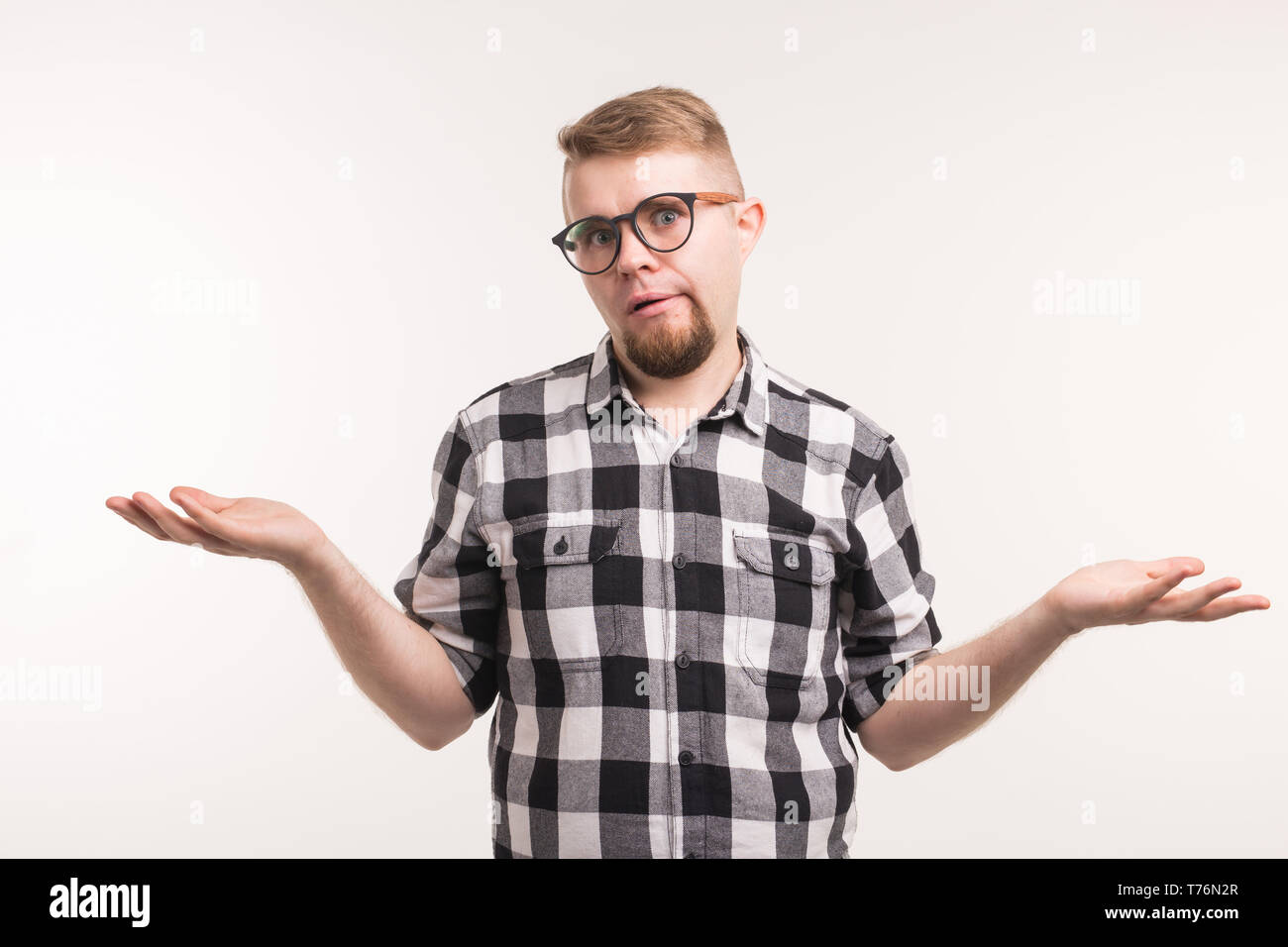 People, emotions and education concept - Student man gesturing shrug ...