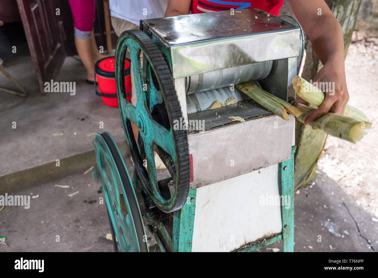 Crush machine working with crushed sugar cane in homegrown store Stock ...