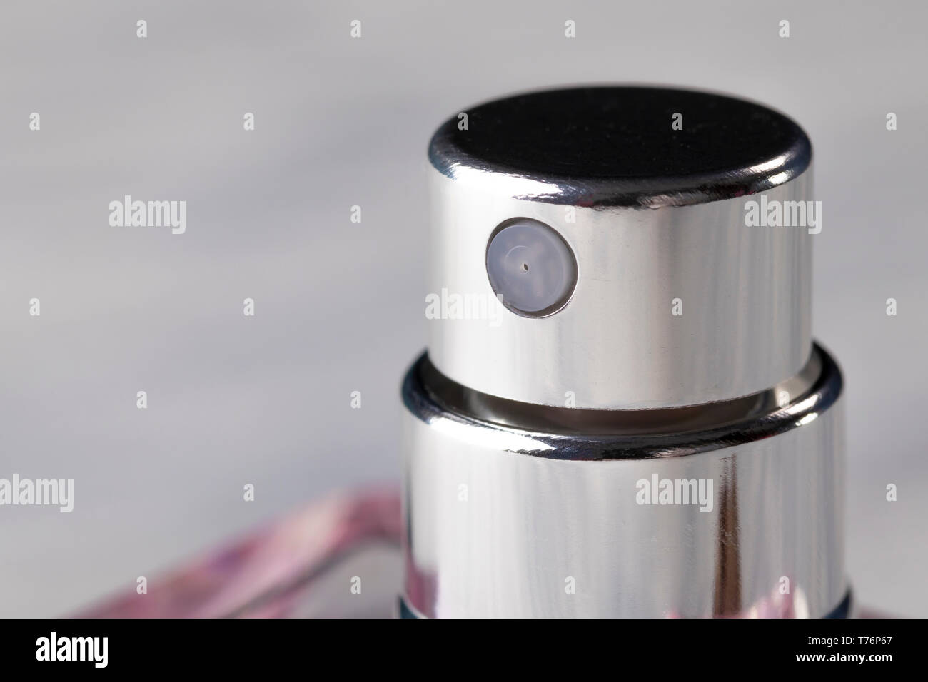 The top of a bottle of perfume or perfume water. plastic spray ...