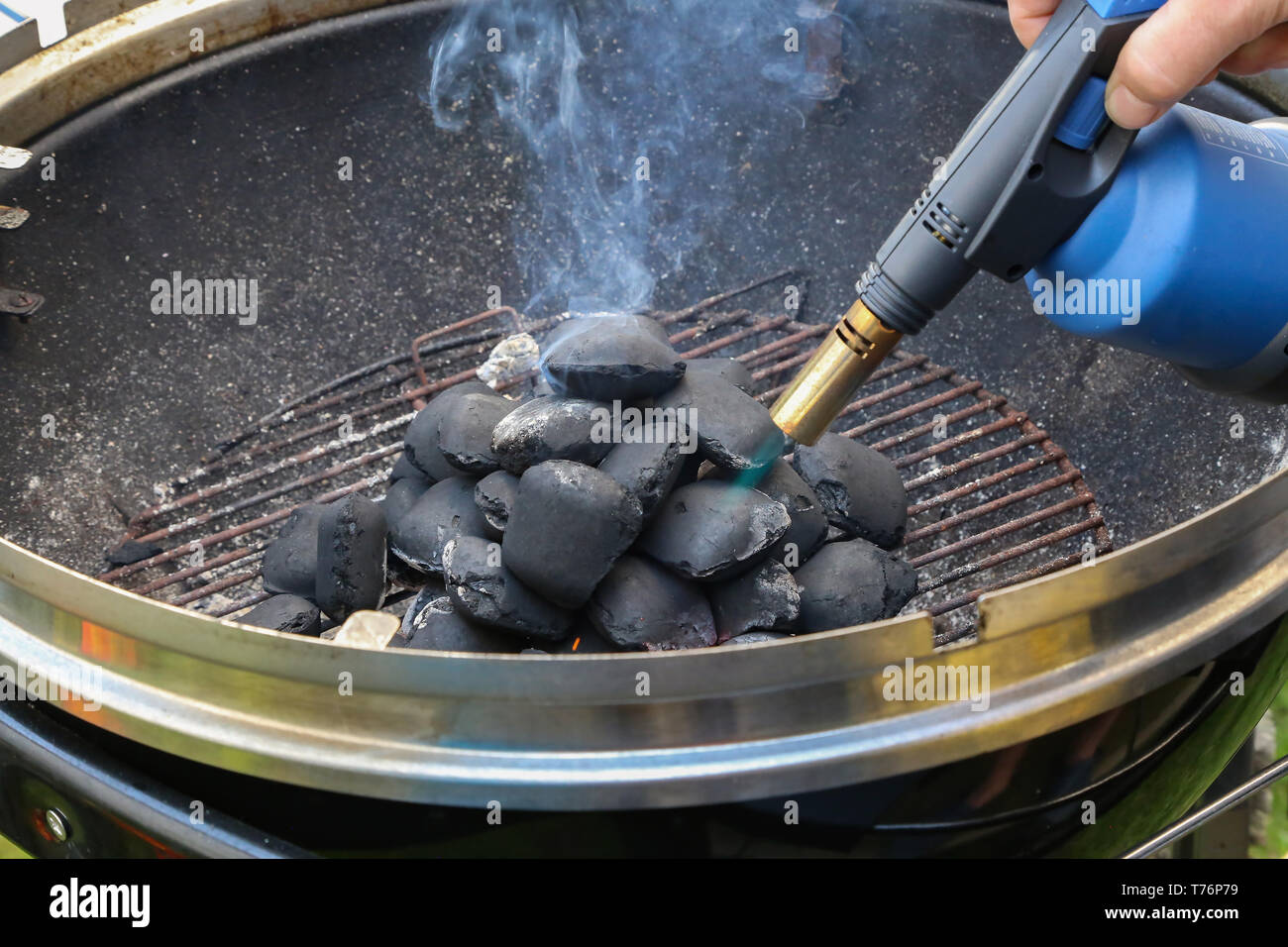 Kindling of fire for cooking on a grill Stock Photo - Alamy