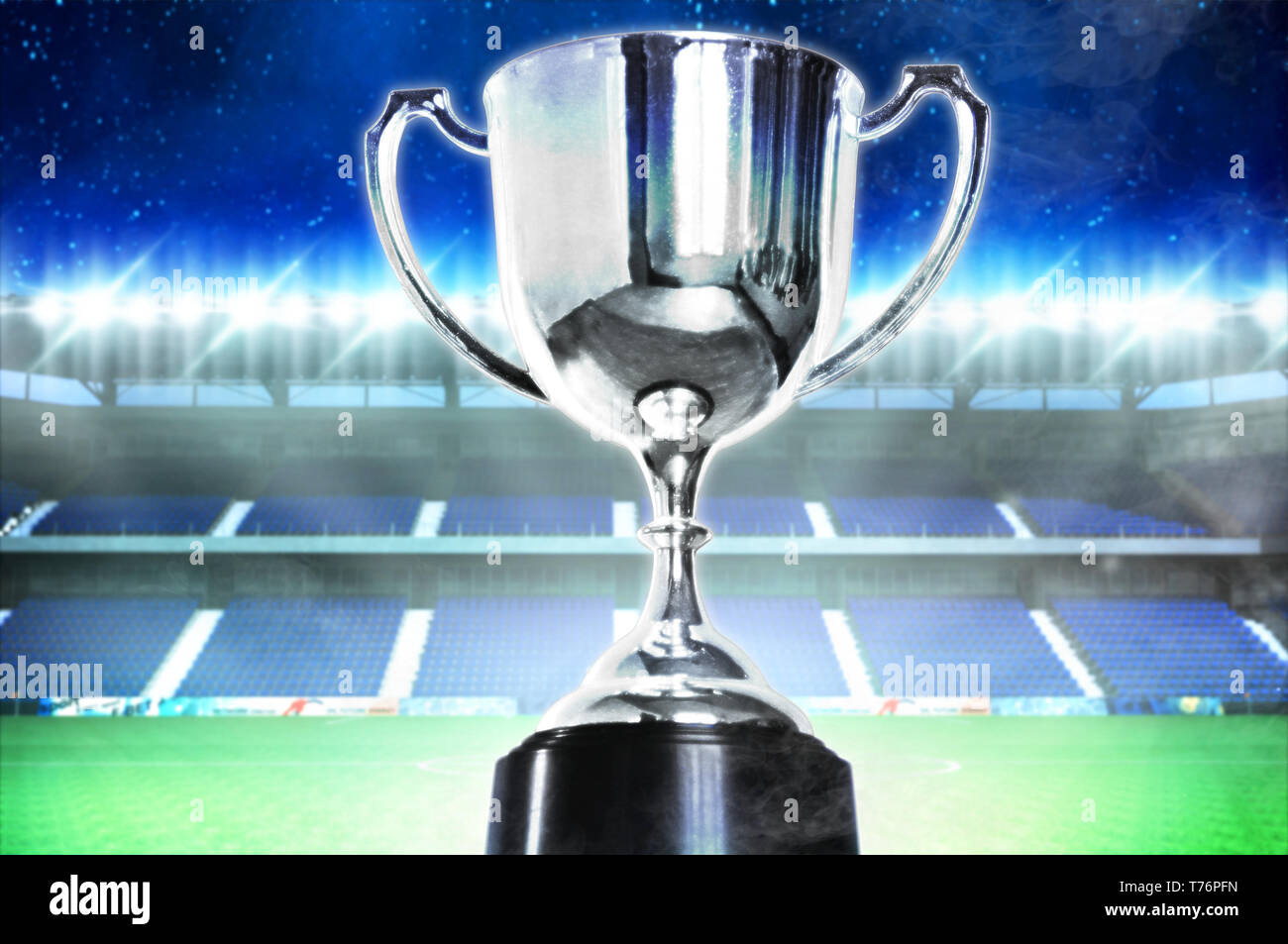 Celebration trophy with background football stadium which open ...