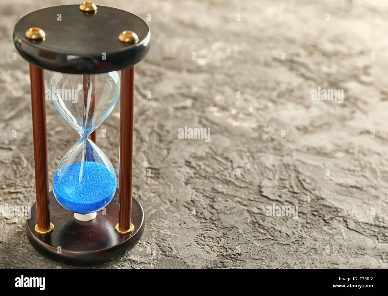 Hourglass on grey textured background. Time management concept Stock ...