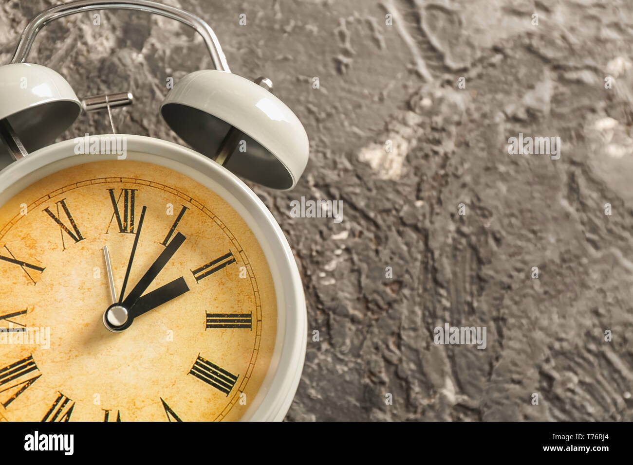 Alarm clock on grey textured background. Time management concept Stock ...