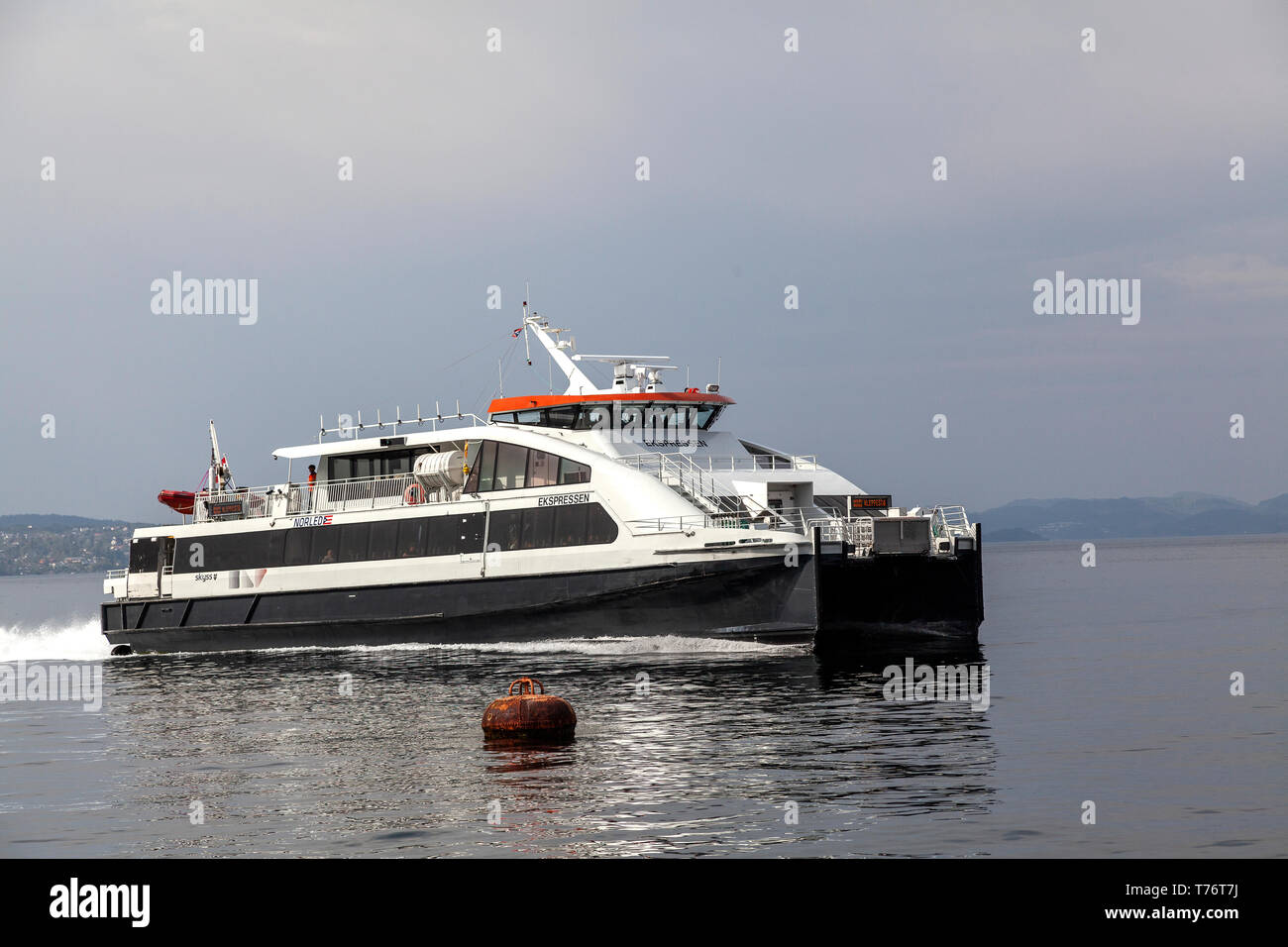 High speed passenger catamaran Ekspressen at Byfjorden, arriving at the ...