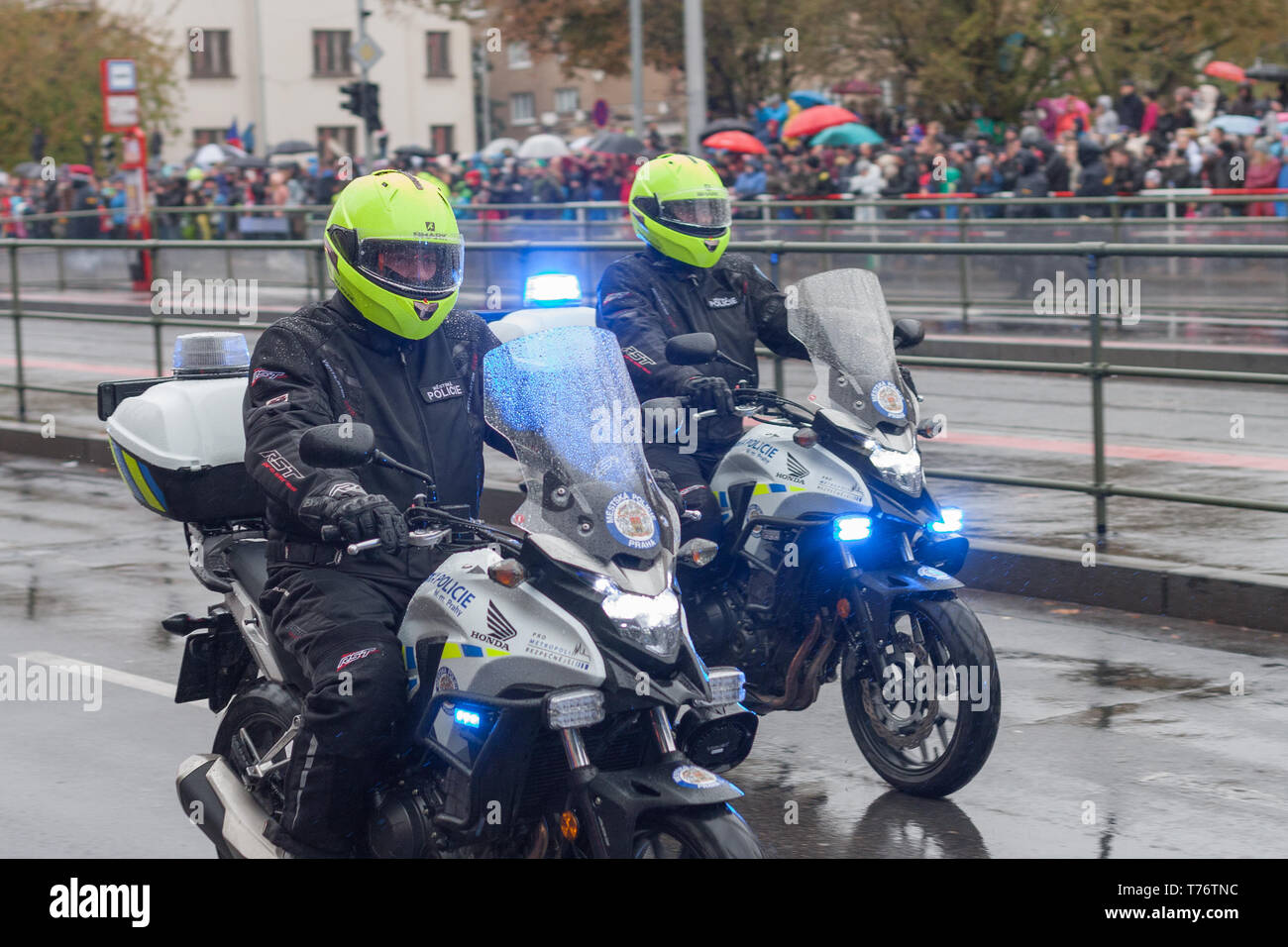 European street, Prague-October 28, 2018: Police workers are riding ...