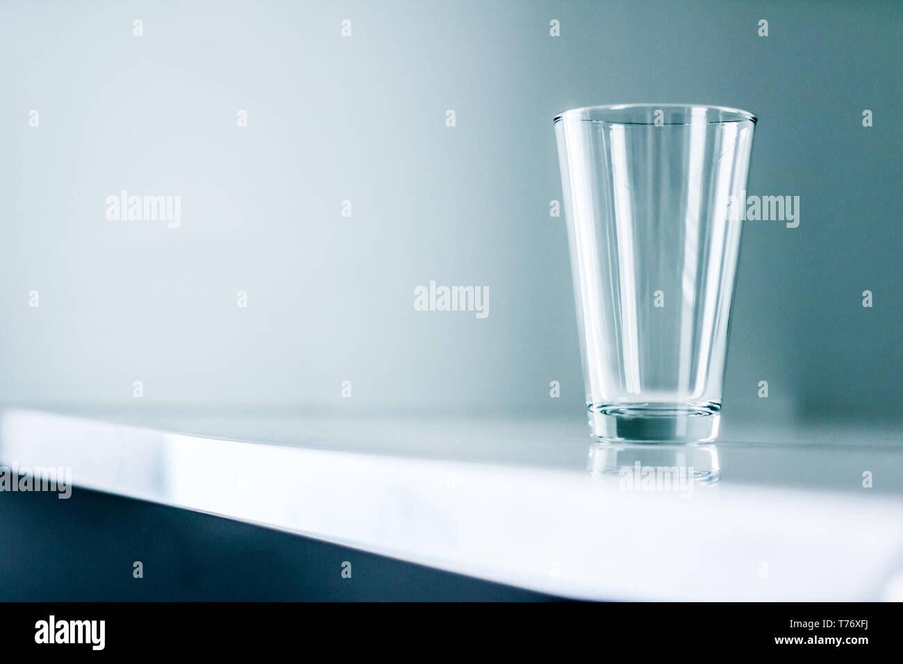 Glassware, washing and purity concept - Clean empty glass on marble ...