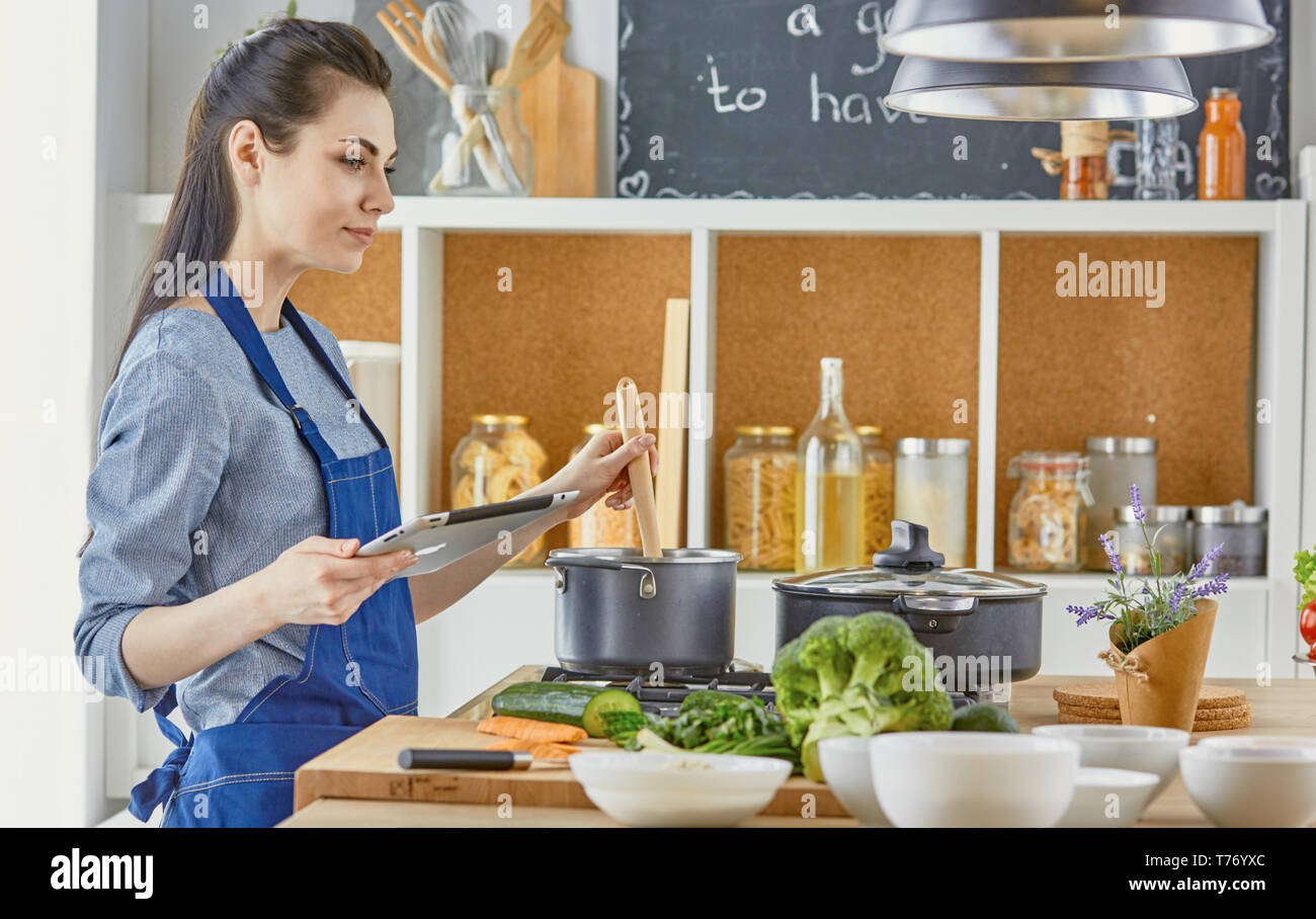 Beautiful happy housewife holding hi-res stock photography and images ...
