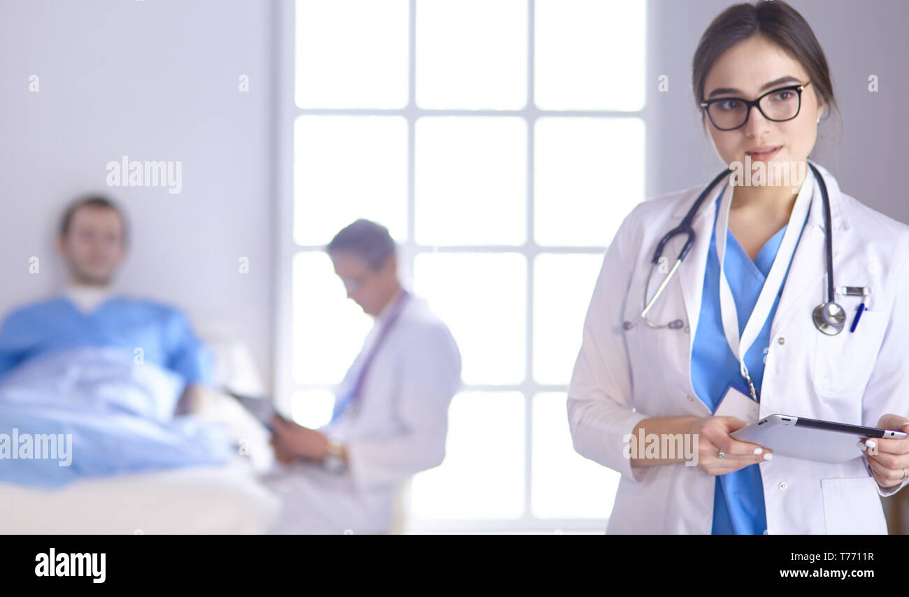 Doctor checking heart beat of patient in bed with stethoscope Stock ...