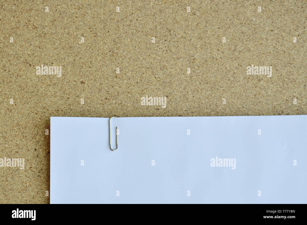 paperclip on white paper Stock Photo - Alamy