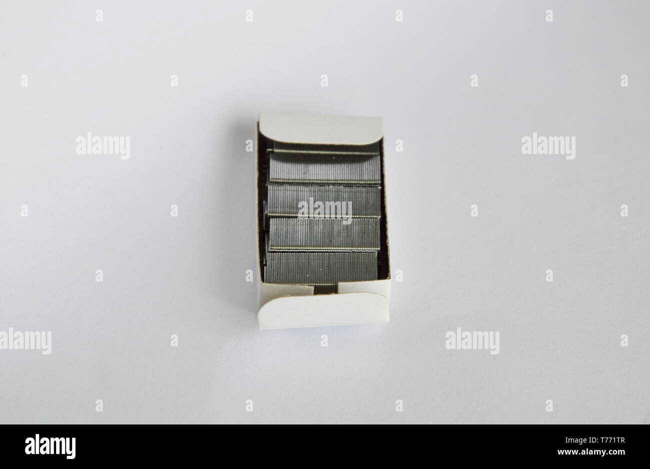 stapler wire in paper box on white background Stock Photo - Alamy