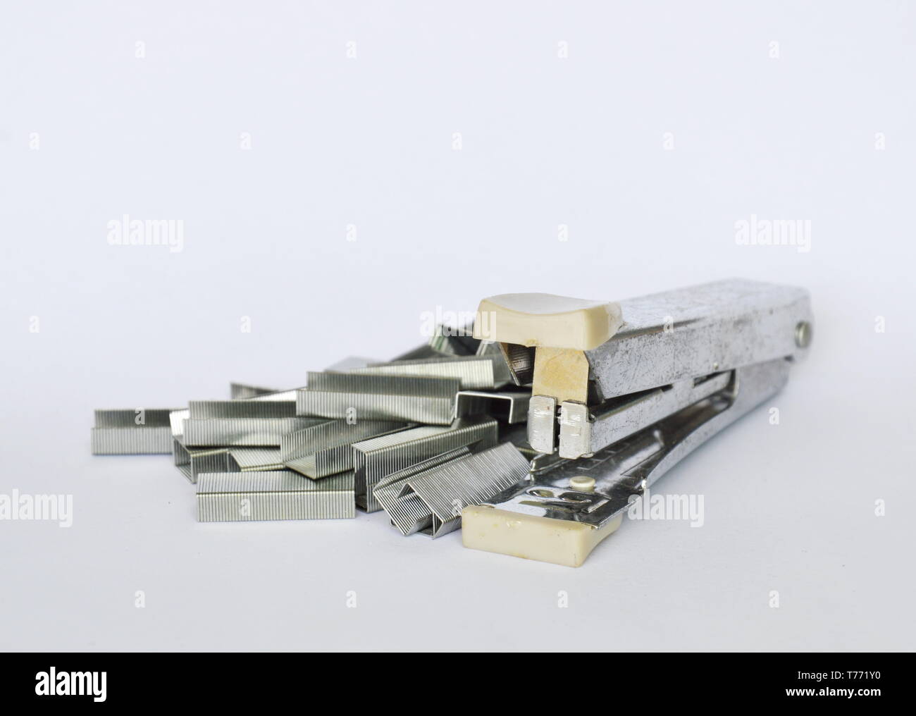 stapler and refill wire on white background Stock Photo - Alamy