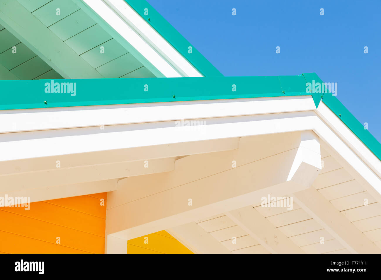 Colourful rooftops and blue sky background Stock Photo - Alamy