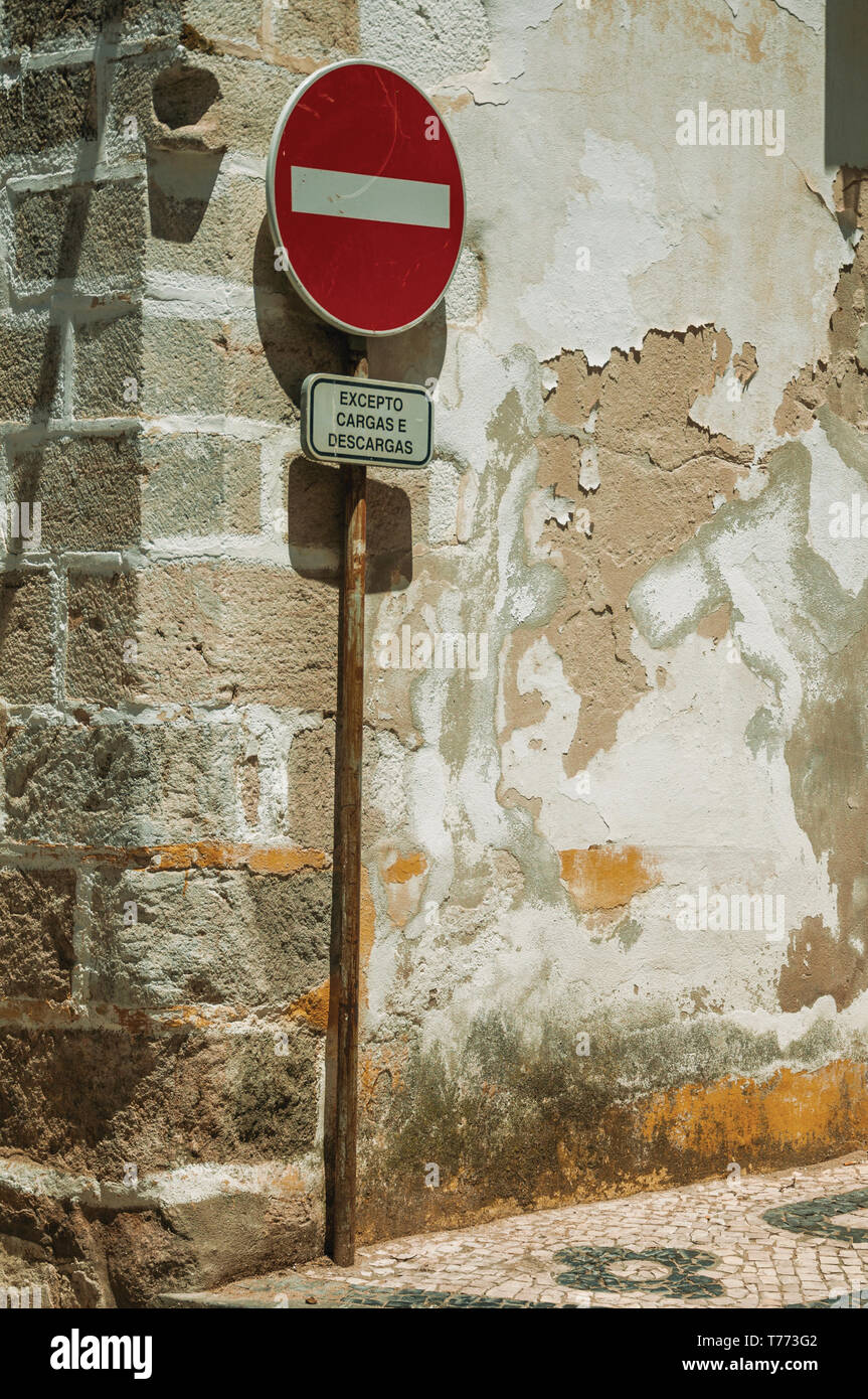 NO ENTRY road sign with a small plate where is written in Portuguese ...