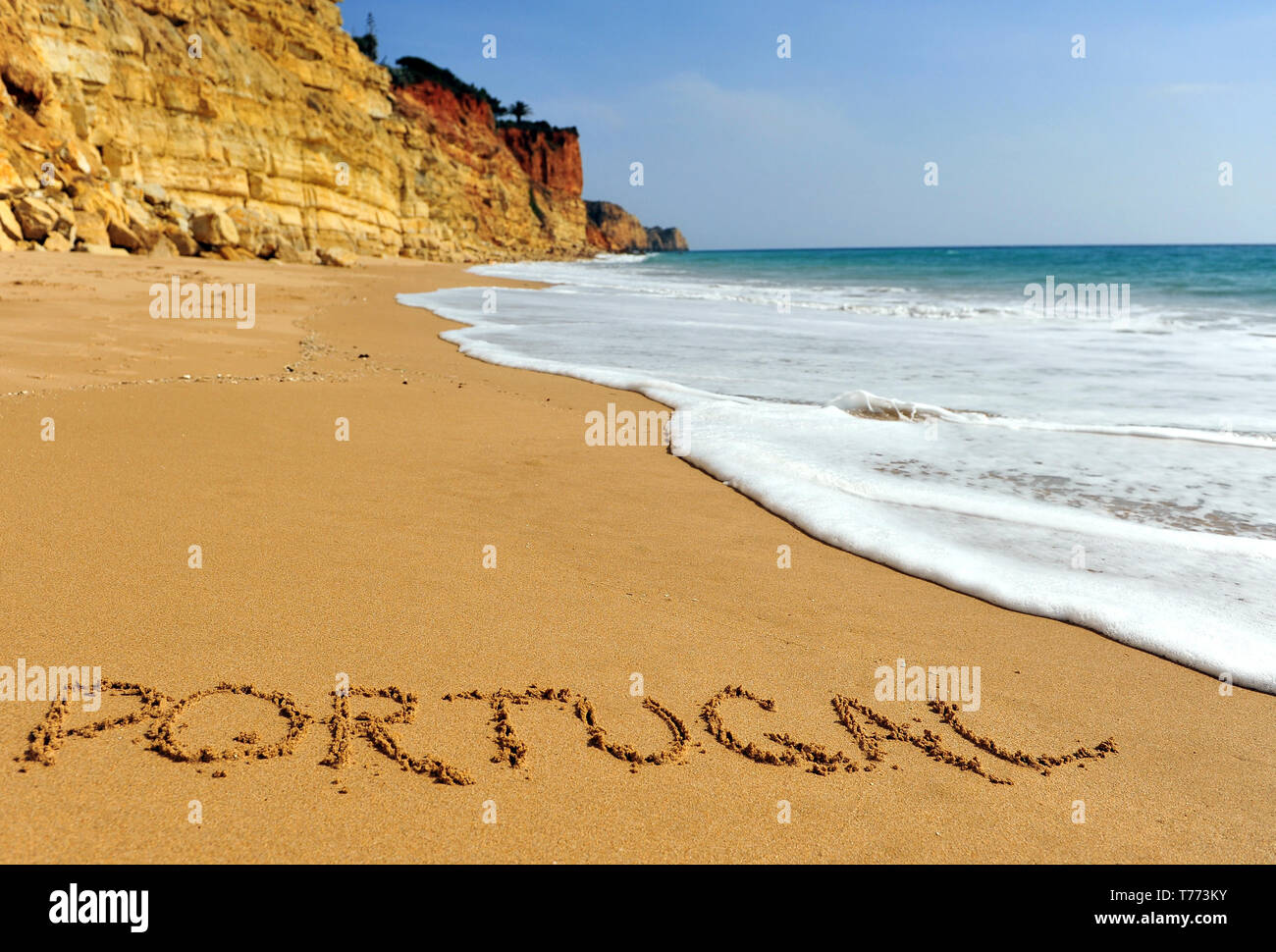 Portugal sign on the sand beach of Lagos, Algarve Stock Photo - Alamy