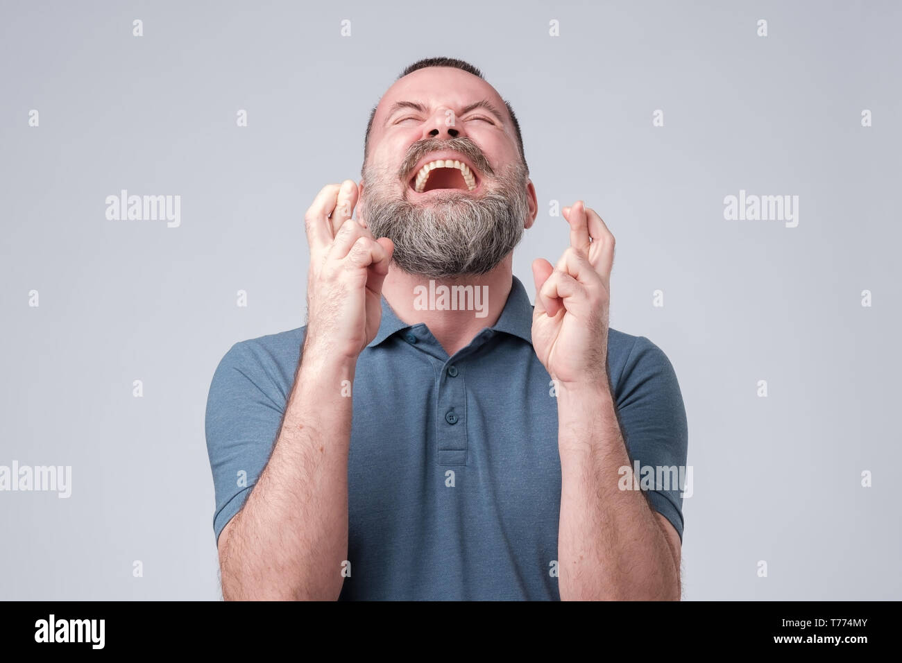 Pleading expression hi-res stock photography and images - Alamy