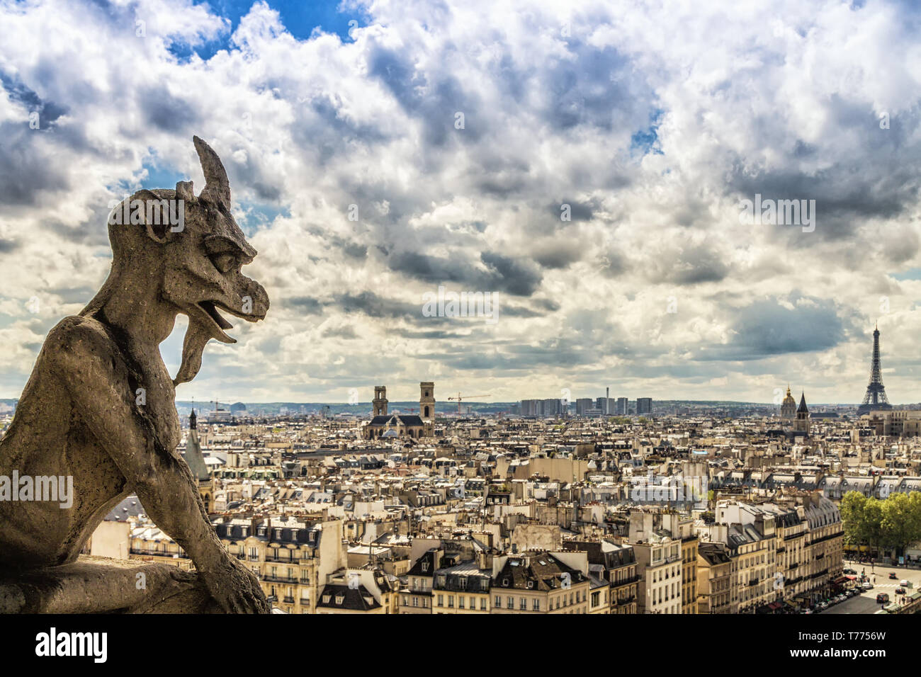 Gargoyle on notre dame with skyline of paris eiffel tower hi-res stock ...