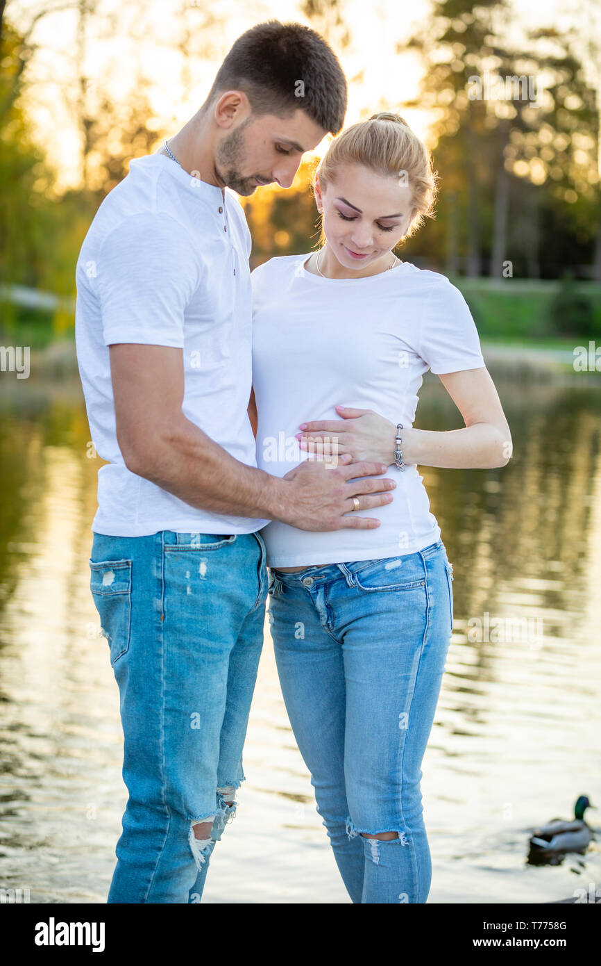 Happy couple expecting baby, pregnant woman with husband, young family ...