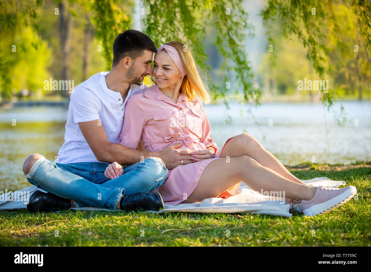 Happy couple expecting baby, pregnant woman with husband, young family ...