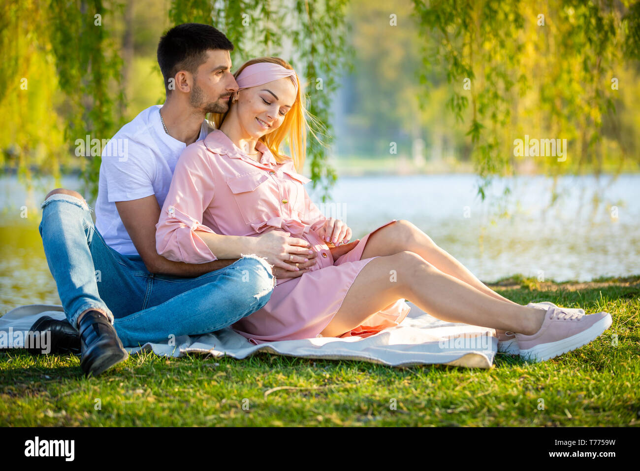 Happy couple expecting baby, pregnant woman with husband, young family ...