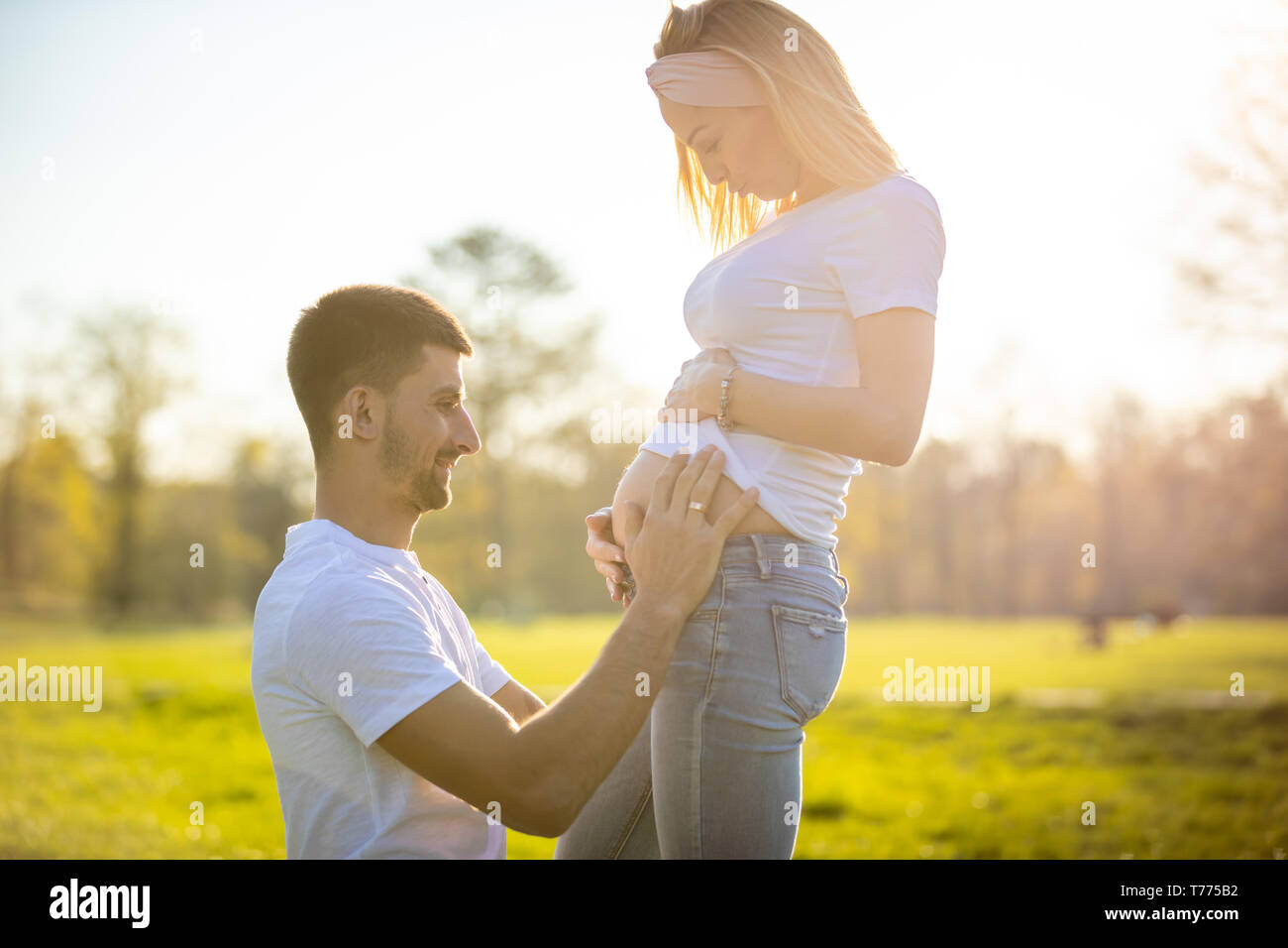Happy couple expecting baby, pregnant woman with husband, young family ...