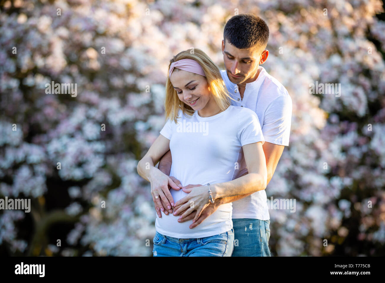 Happy couple expecting baby, pregnant woman with husband, young family ...