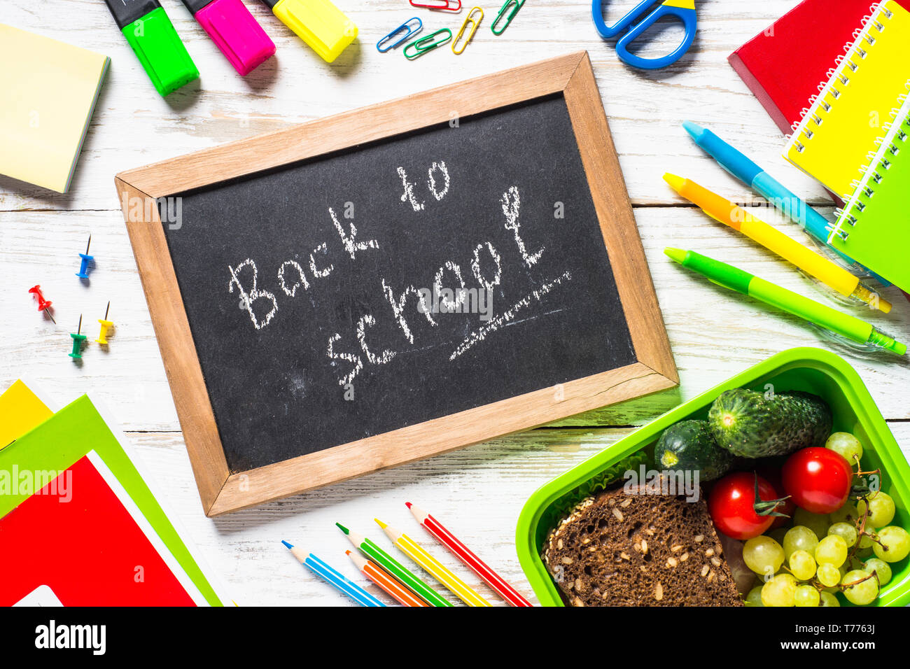 Back to school concept. Lunch box with stationery and backpack Stock ...