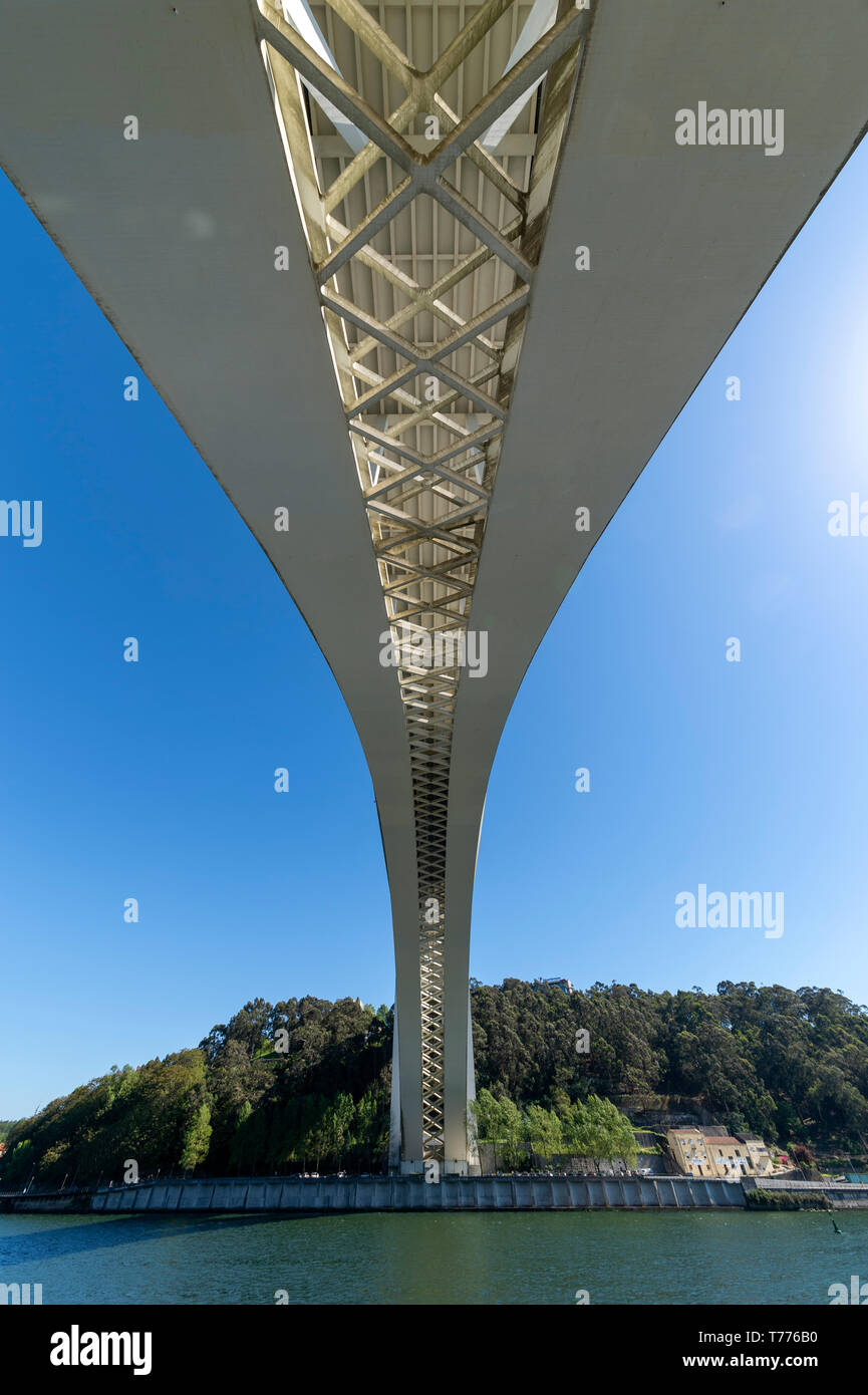 underneath the modern concrete Ponte da Arrabida bridge in Porto ...