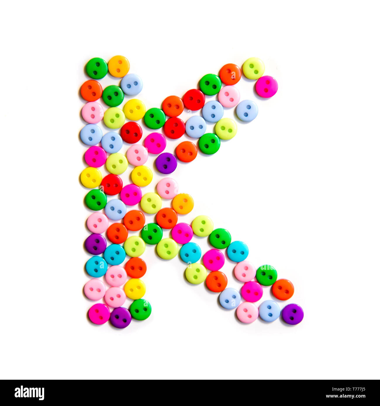 Letter K of the English alphabet from a group of colorful small buttons ...