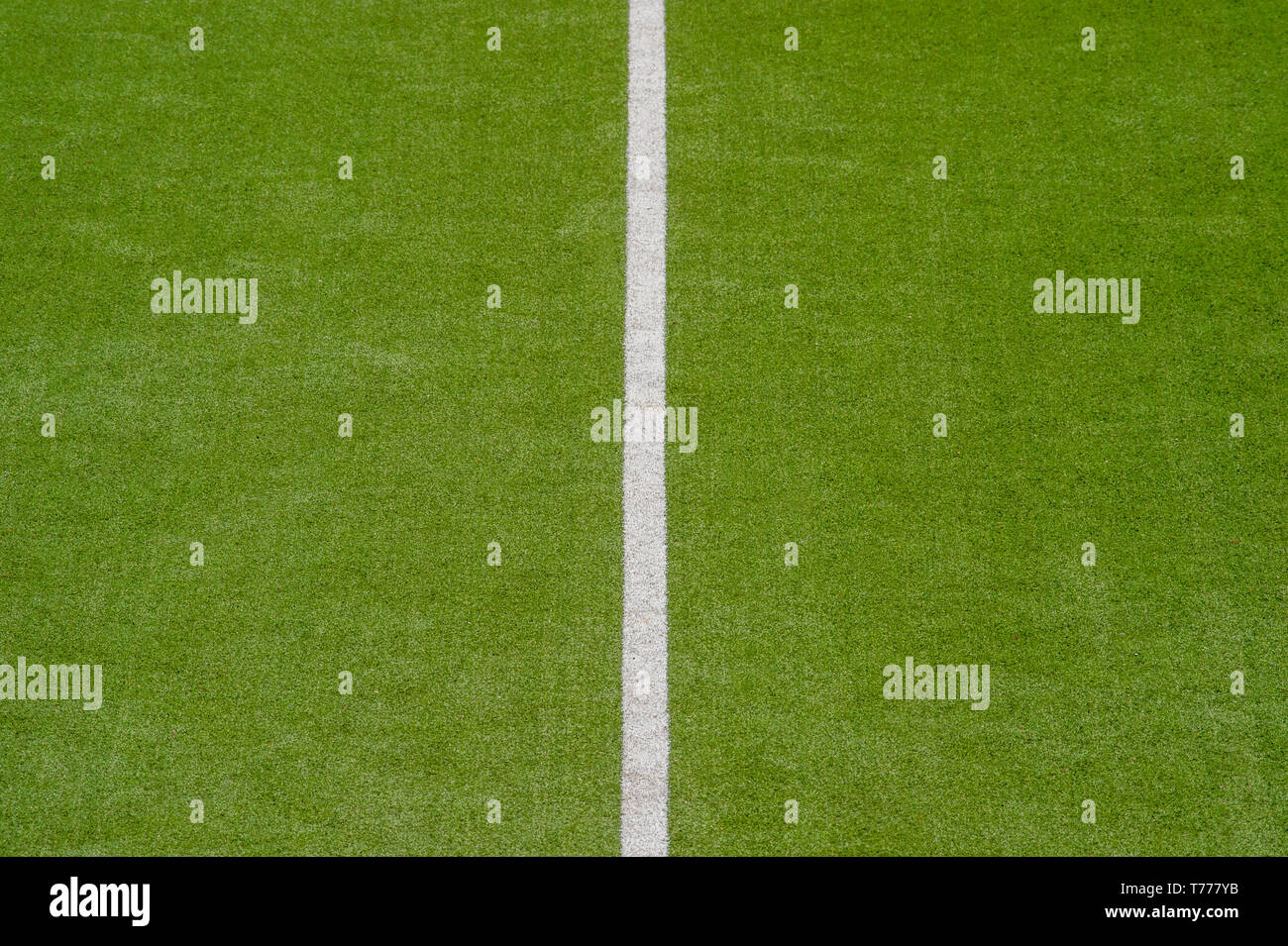 Artificial green turf texture background with white line marks Stock ...